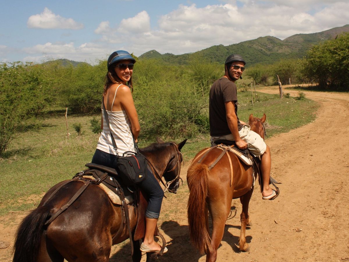 “Horseback Riding Through the Sugar Mills Valley at the foot of the ...
